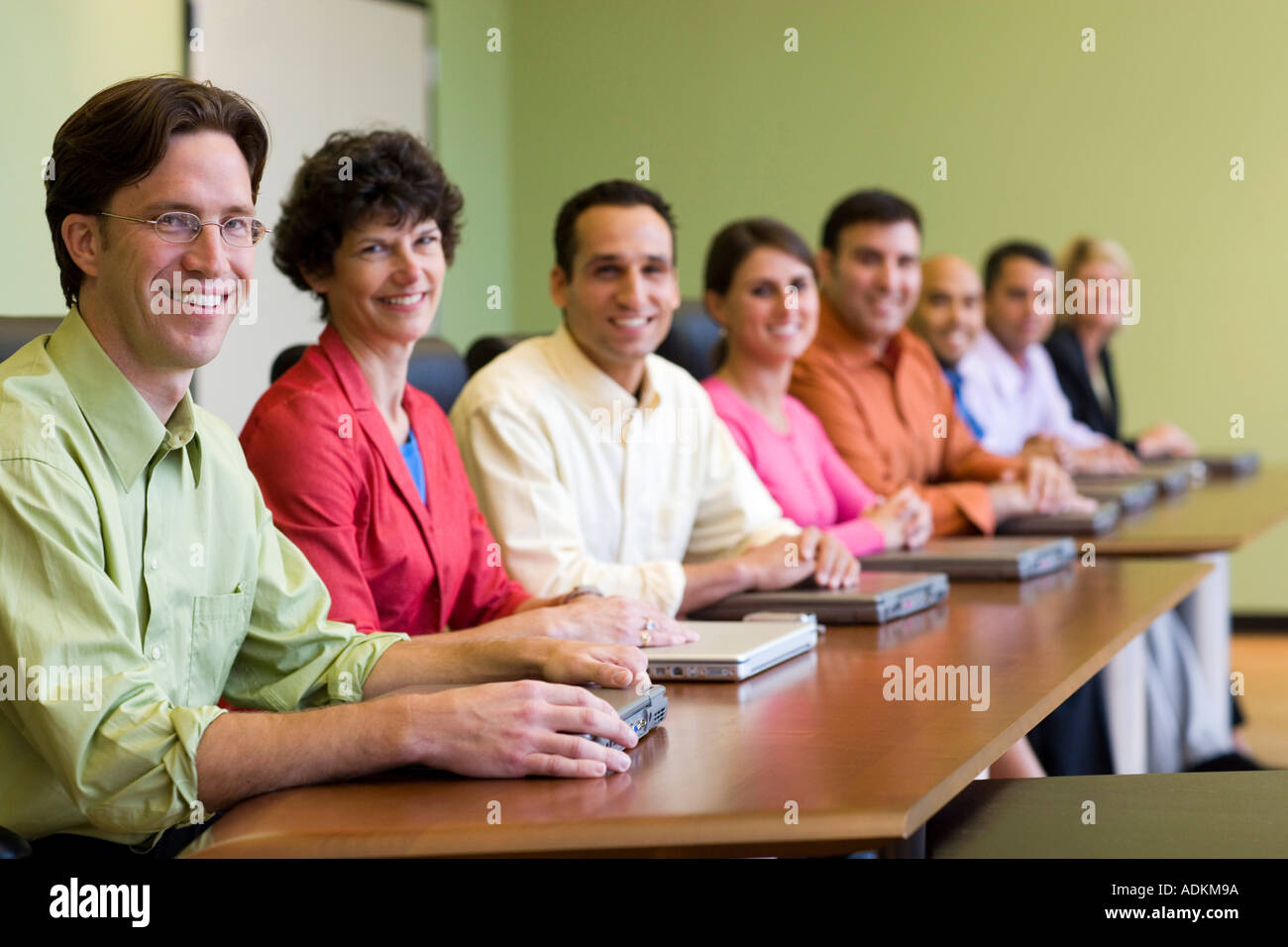 Executives sitting around conference table hi-res stock photography and ...