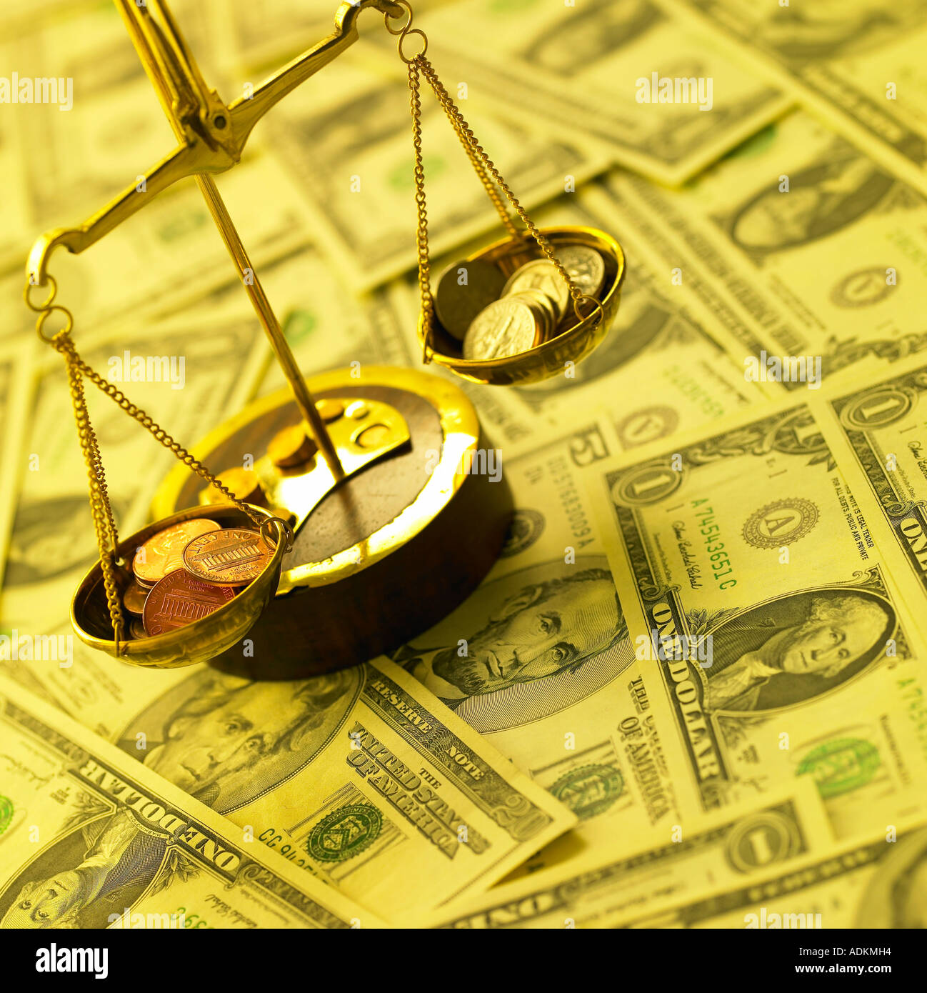 finance a scale and coins on a paper money Stock Photo - Alamy