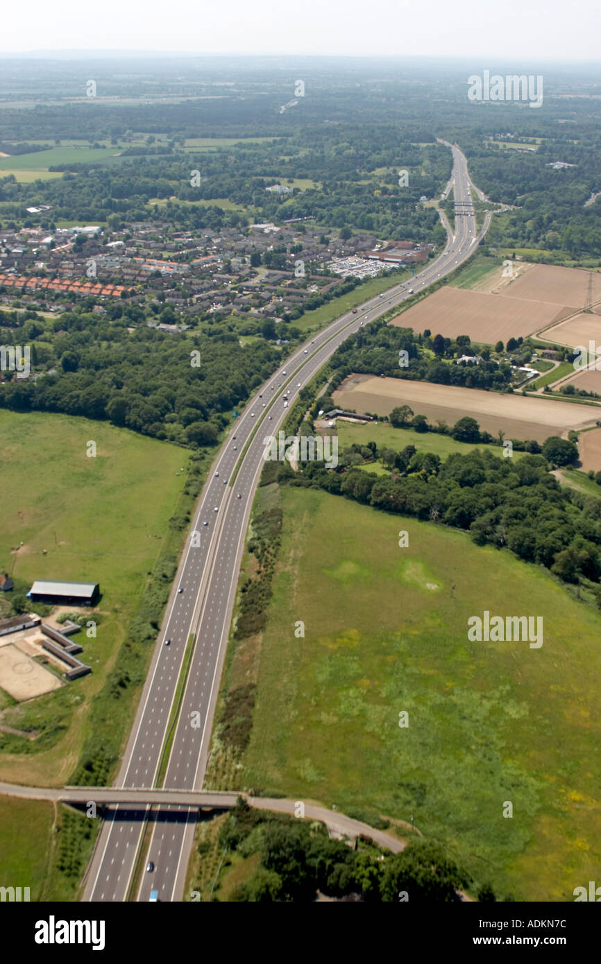 Oblique high level aerial view west of Esher Bypass London KT11 England ...