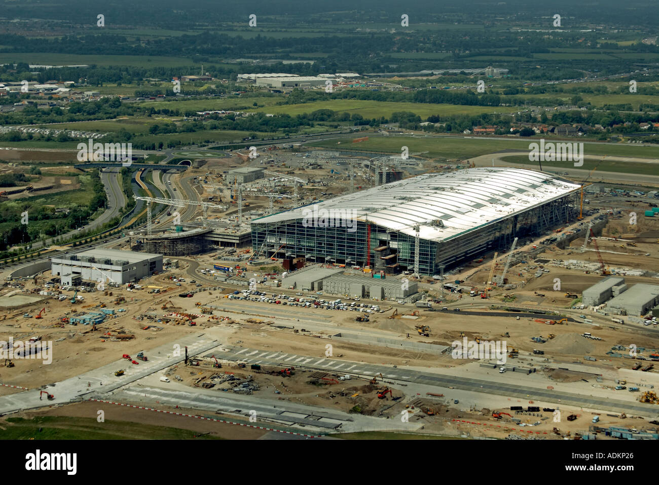 Oblique high level aerial view of Terminal Five 5 building construction ...