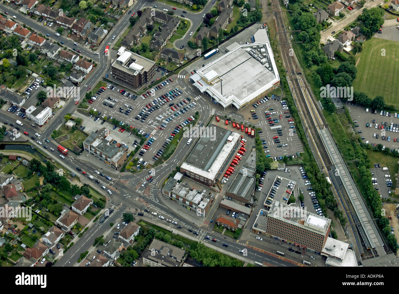 Oblique high level aerial view south of Enfield with Enfield Town Rail ...