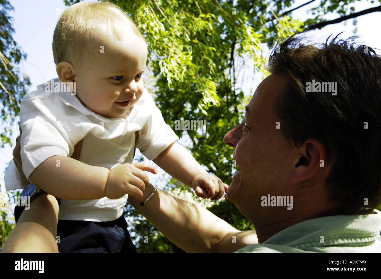 father holding baby son Stock Photo - Alamy