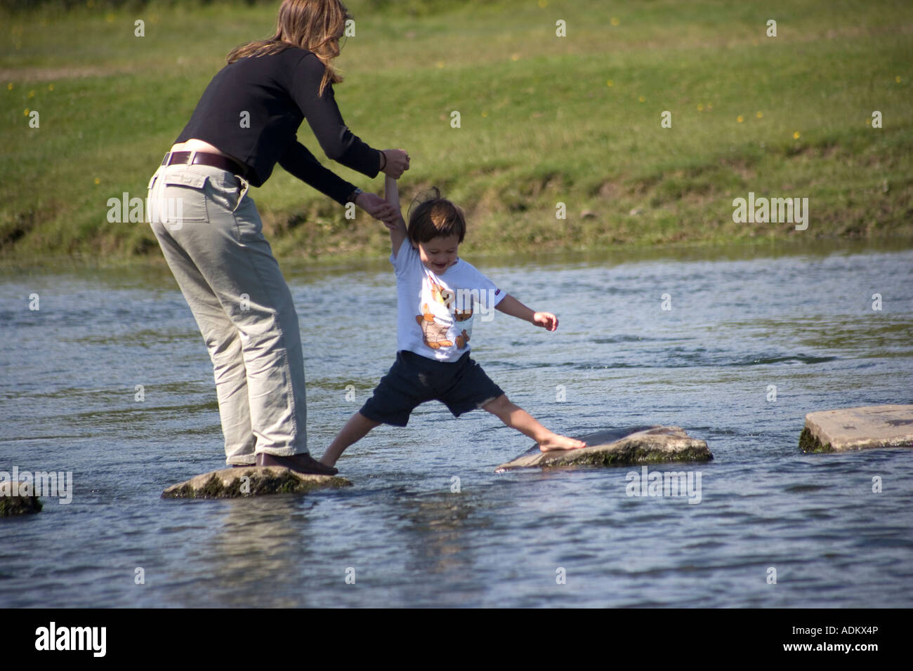 Child stepping stones hi-res stock photography and images - Alamy