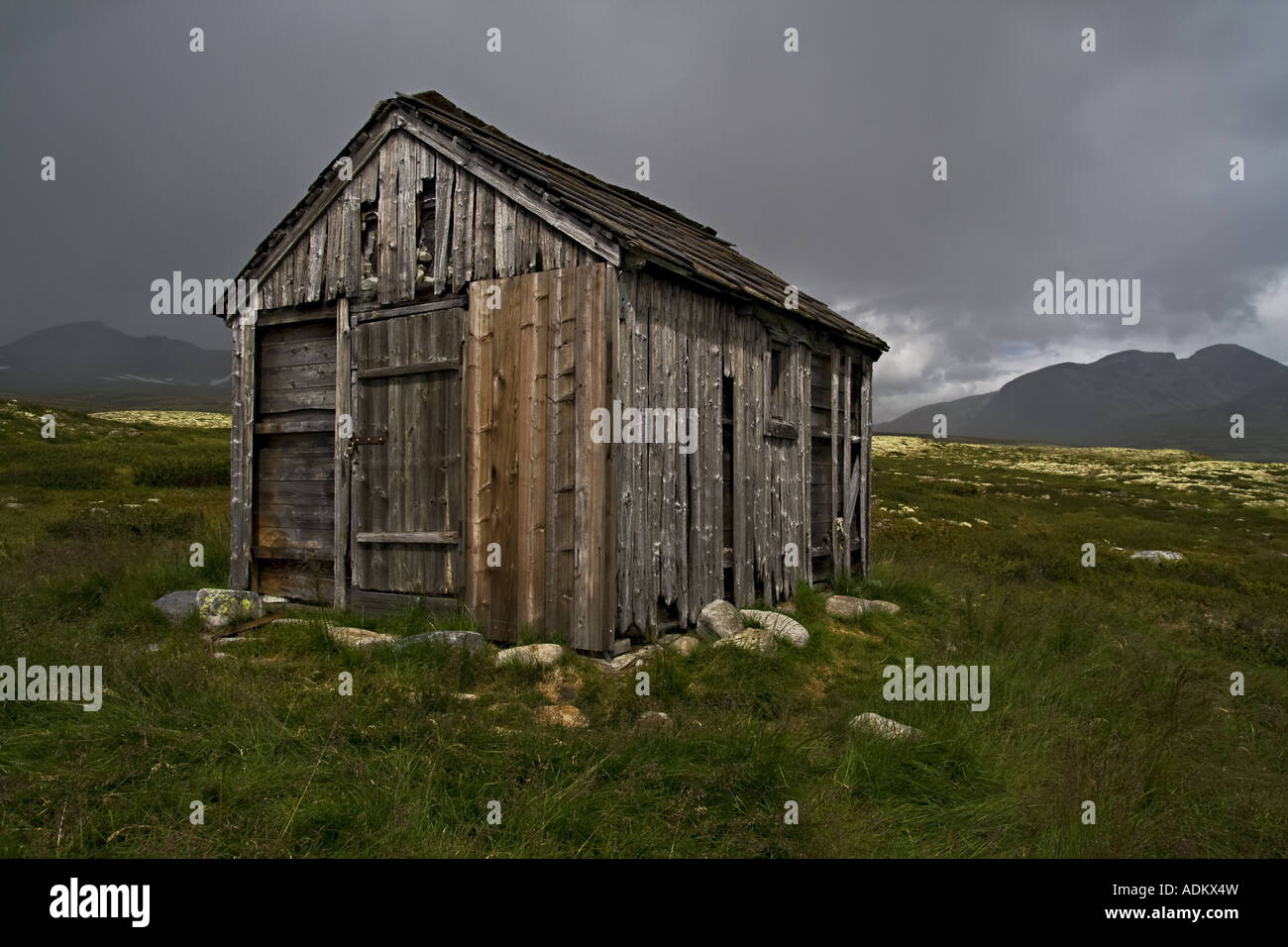 mountain landscape with derelict cabin Stock Photo - Alamy