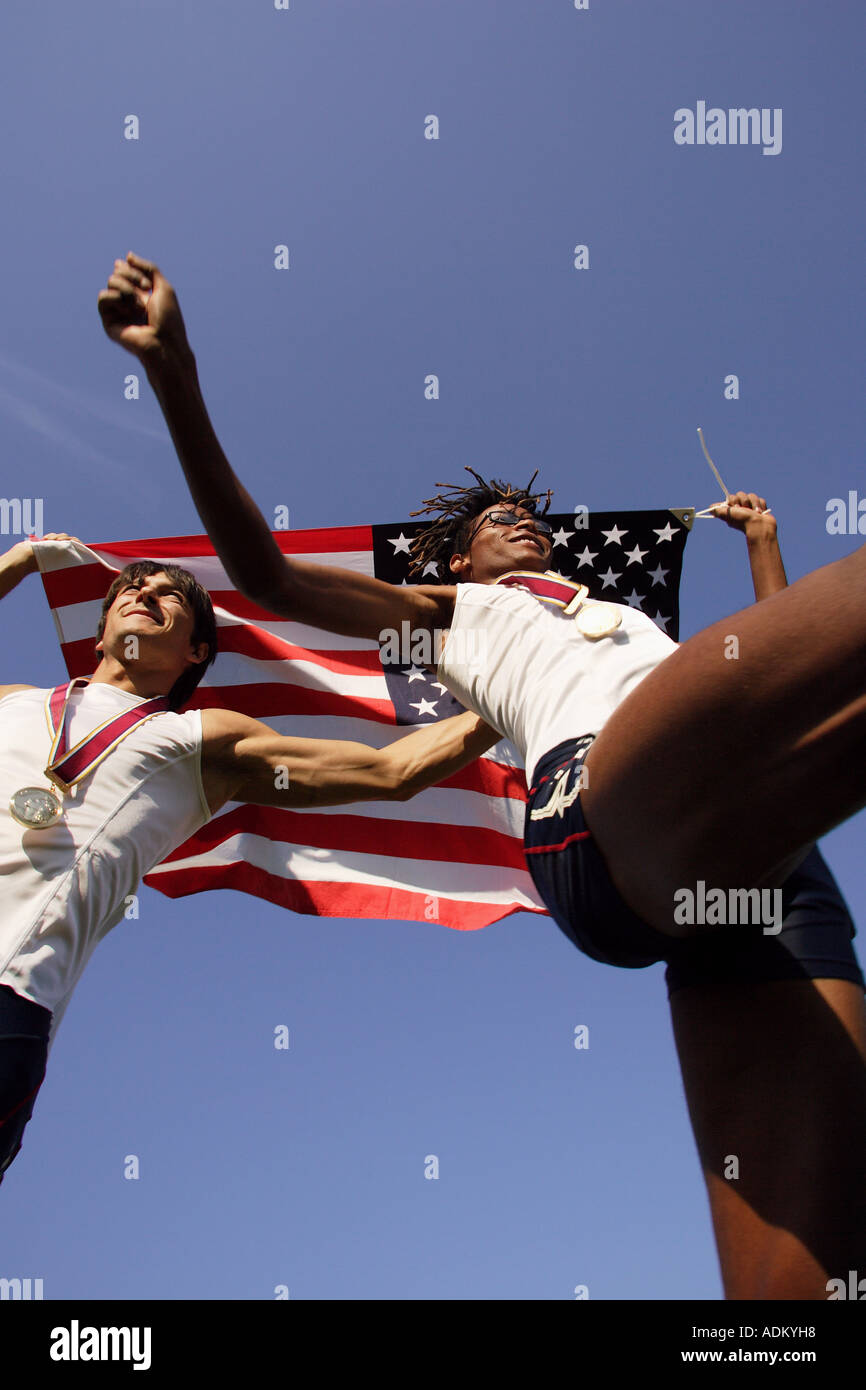 Male Runners Carrying US Flag Stock Photo - Alamy