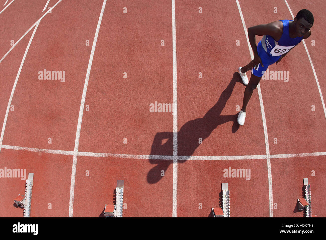 Male Runner Approaching Starting Blocks Stock Photo - Alamy