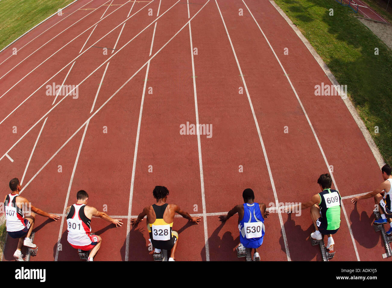 Male Runners Sprinting Down Track Stock Photo - Alamy