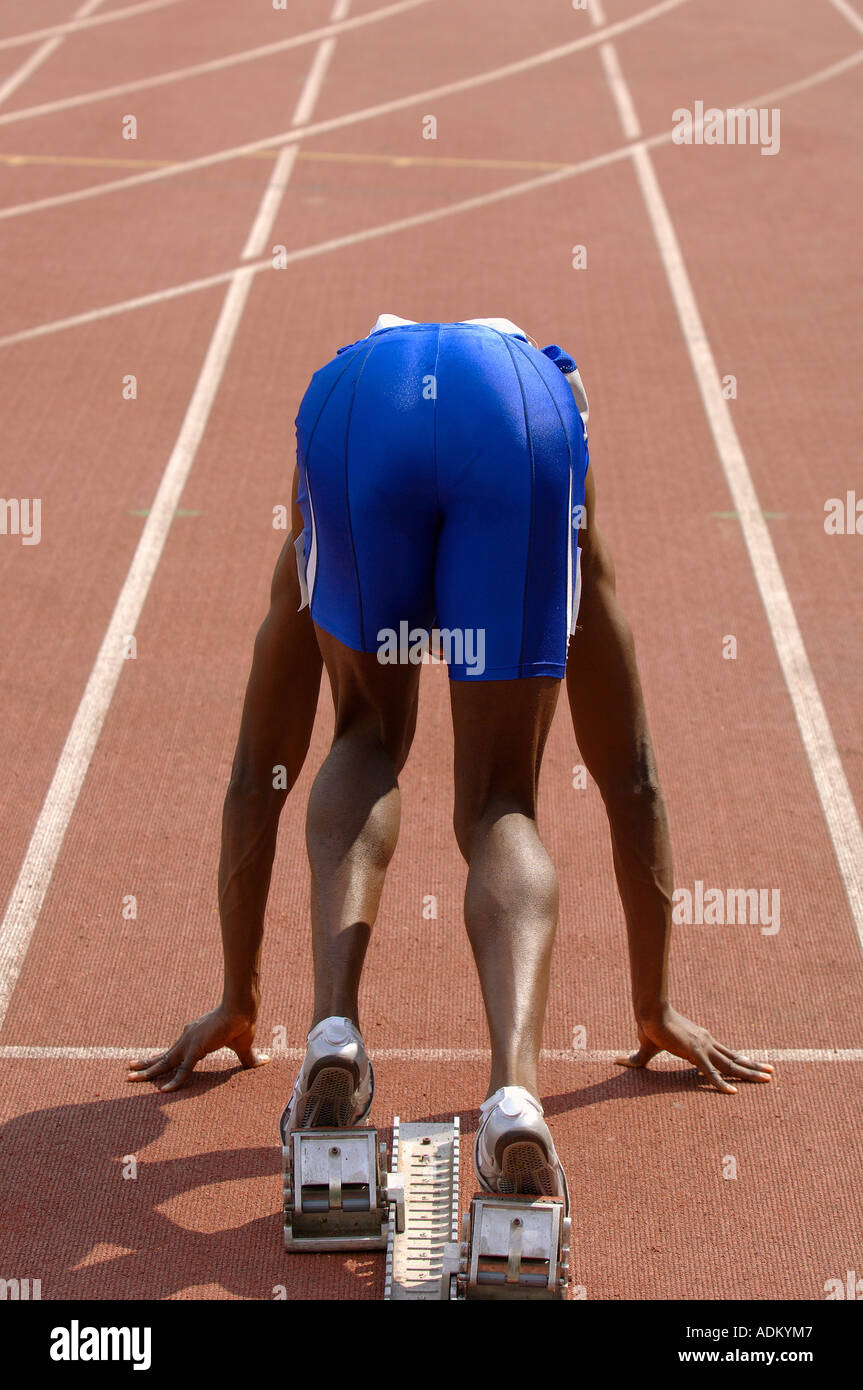 African man crouched hi-res stock photography and images - Alamy