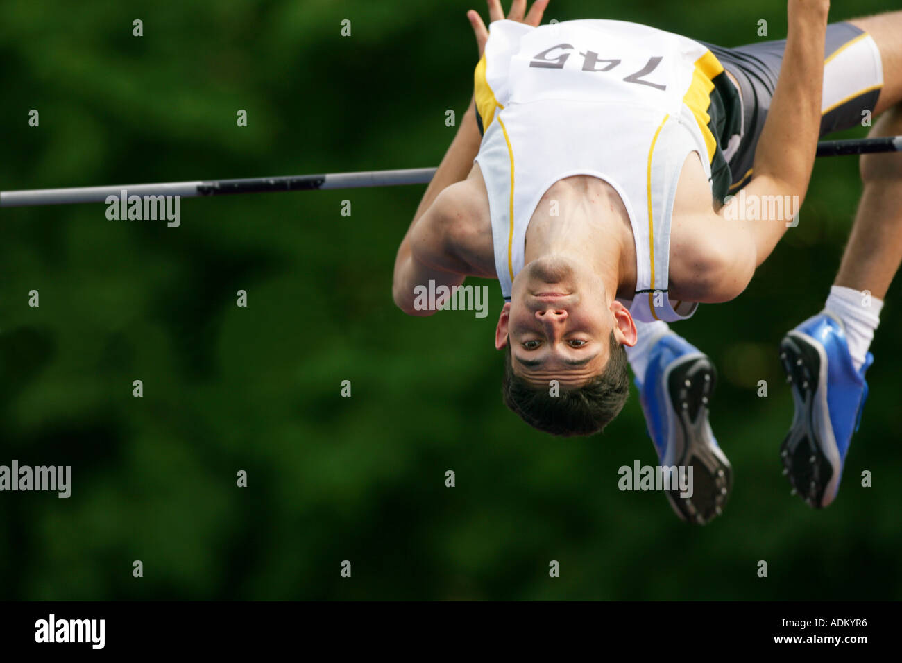 Male High Jumper Clearing the Bar Stock Photo - Alamy