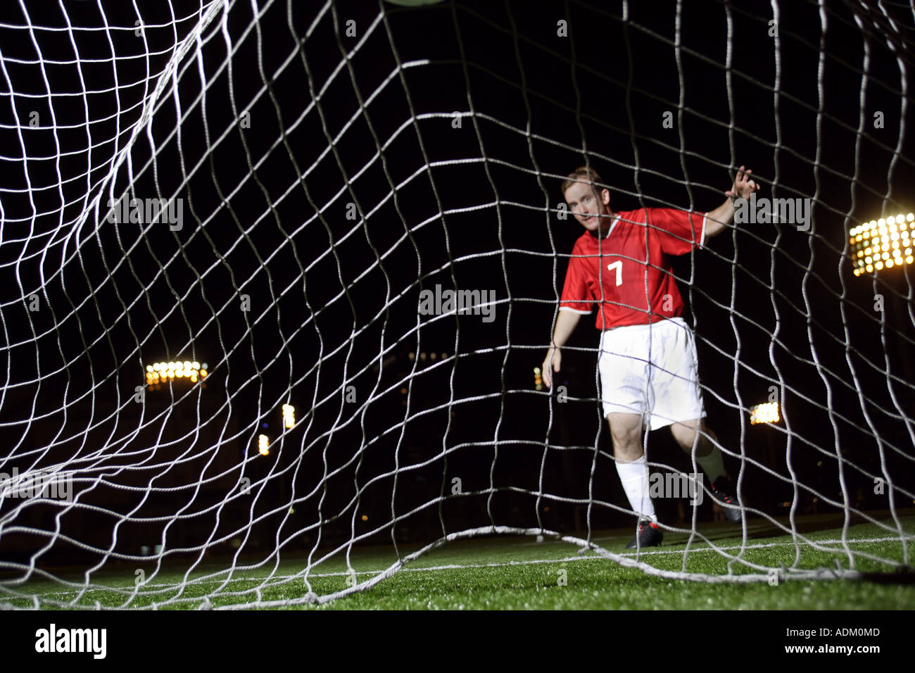 Footballer Behind Net High Resolution Stock Photography and Images - Alamy