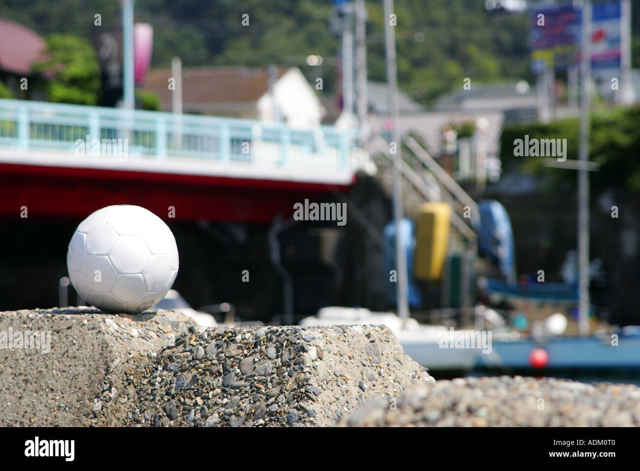 Soccer Ball On A Jetty Stock Photo - Alamy