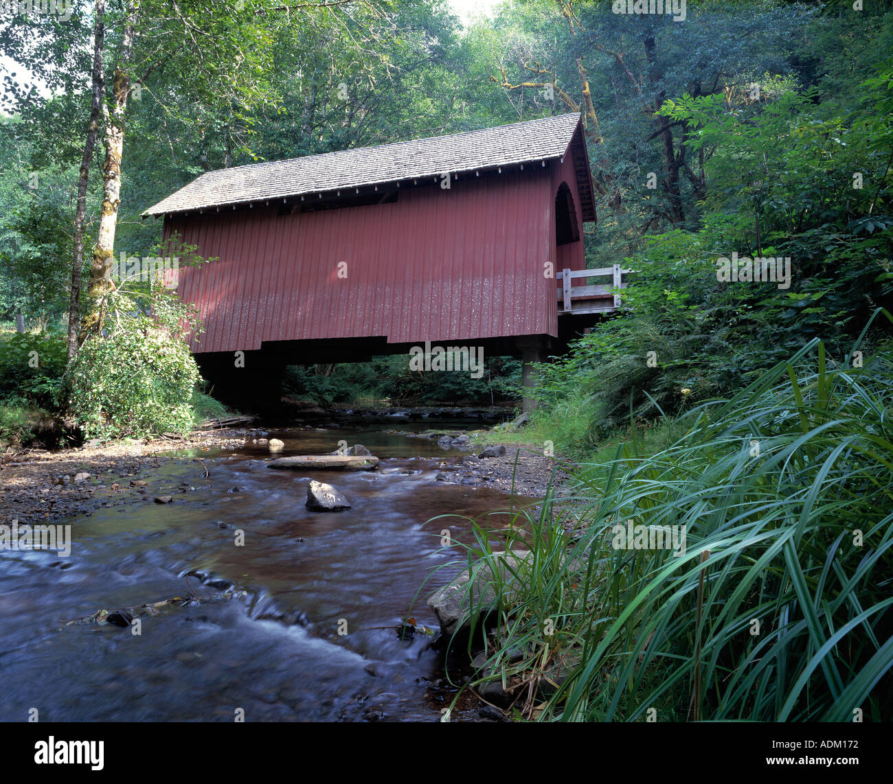 Covered Bridge Over a Stream Stock Photo - Alamy