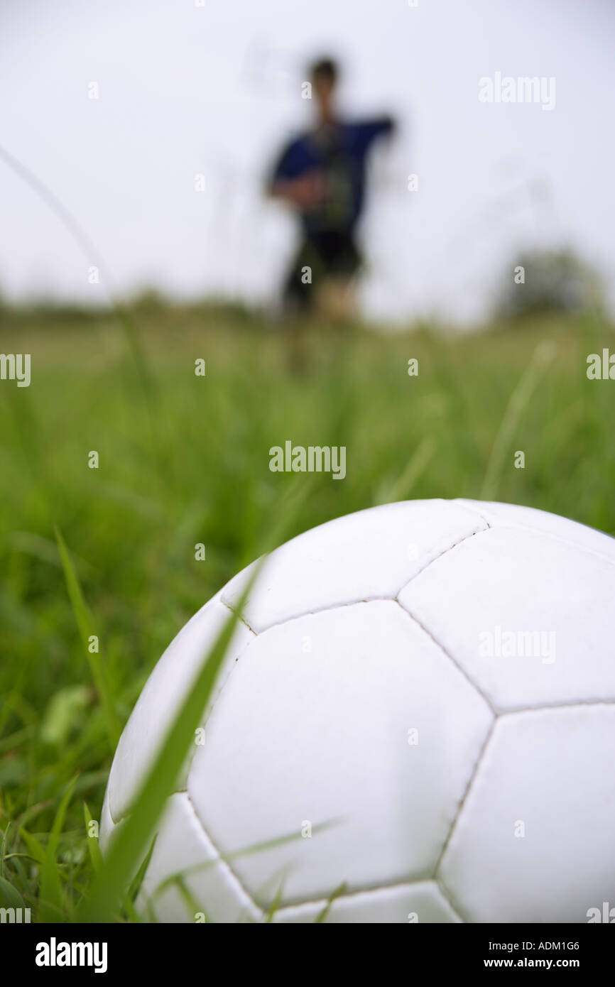 Soccer Player Running To Kick A Soccer Ball Stock Photo - Alamy
