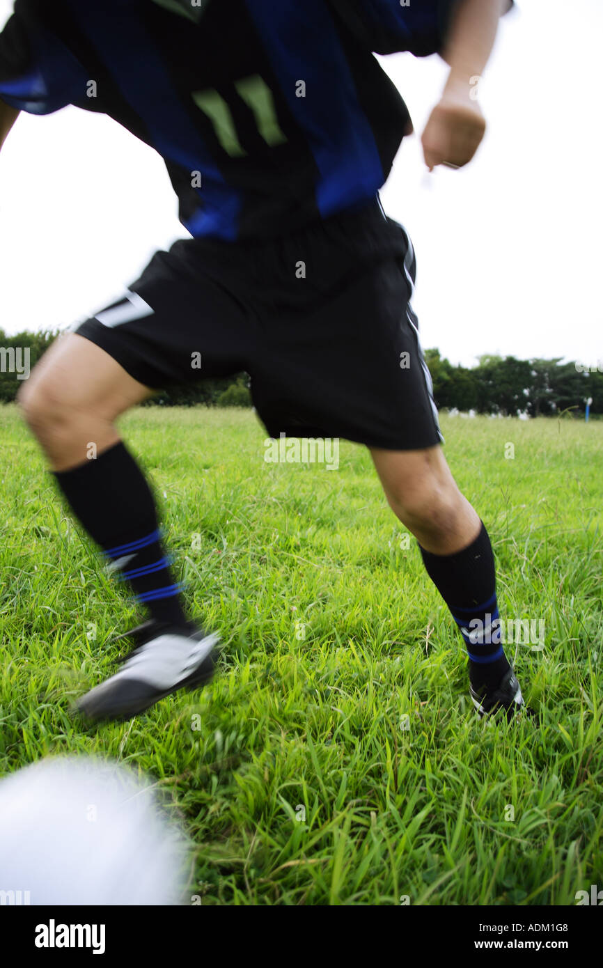 Football ball run running action hi-res stock photography and images ...