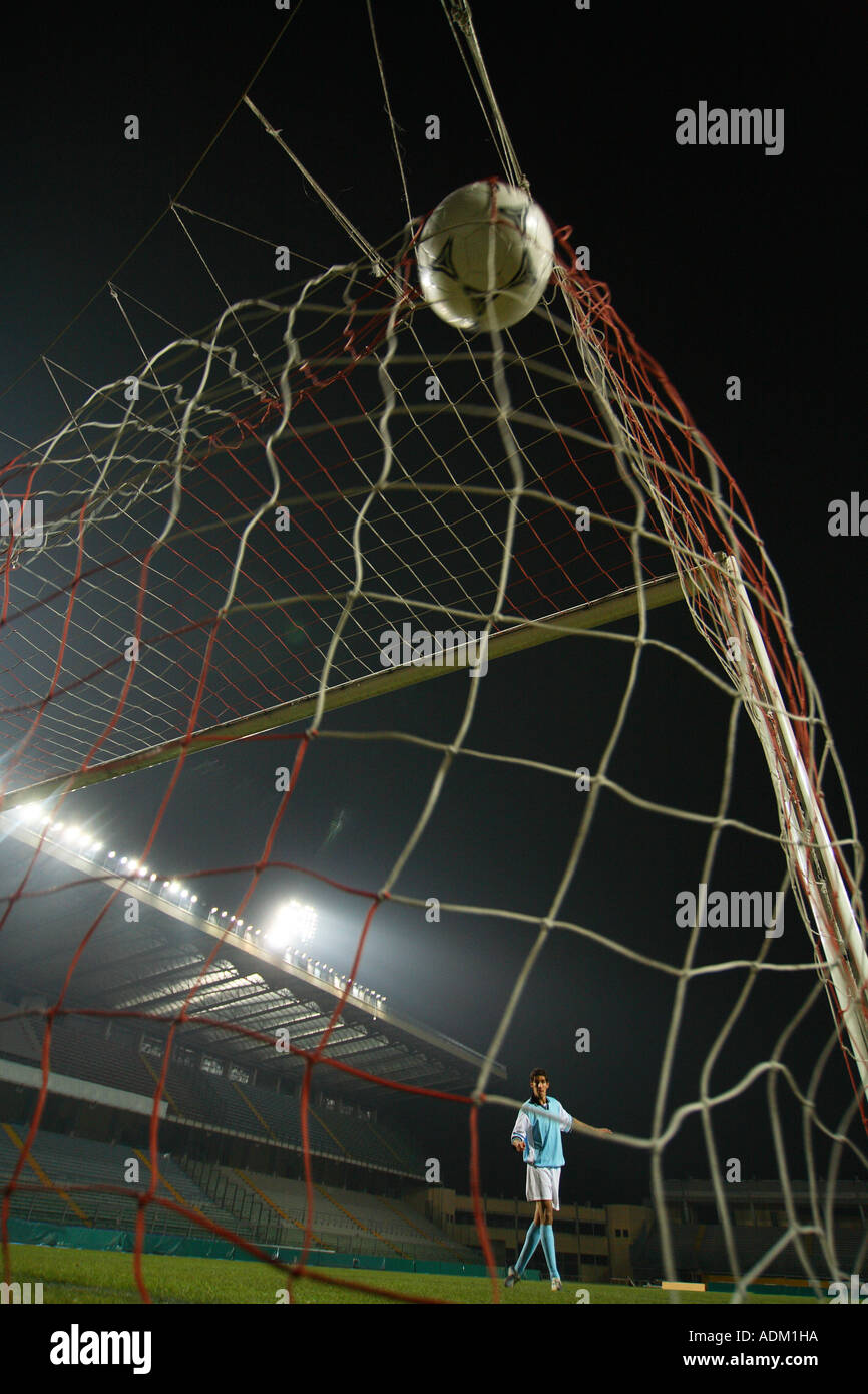 Soccer Ball Entering A Net Stock Photo - Alamy
