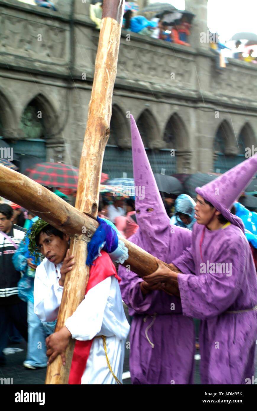 Penitent carrying cross in procession hi-res stock photography and ...