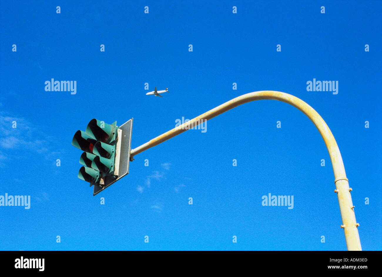 plane flying over traffic lights Stock Photo - Alamy