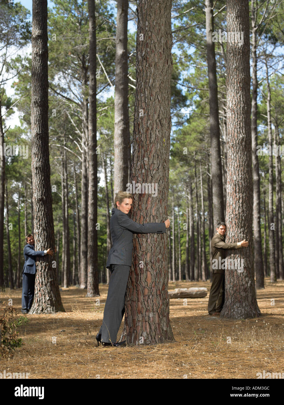 Office workers hugging trees Stock Photo - Alamy