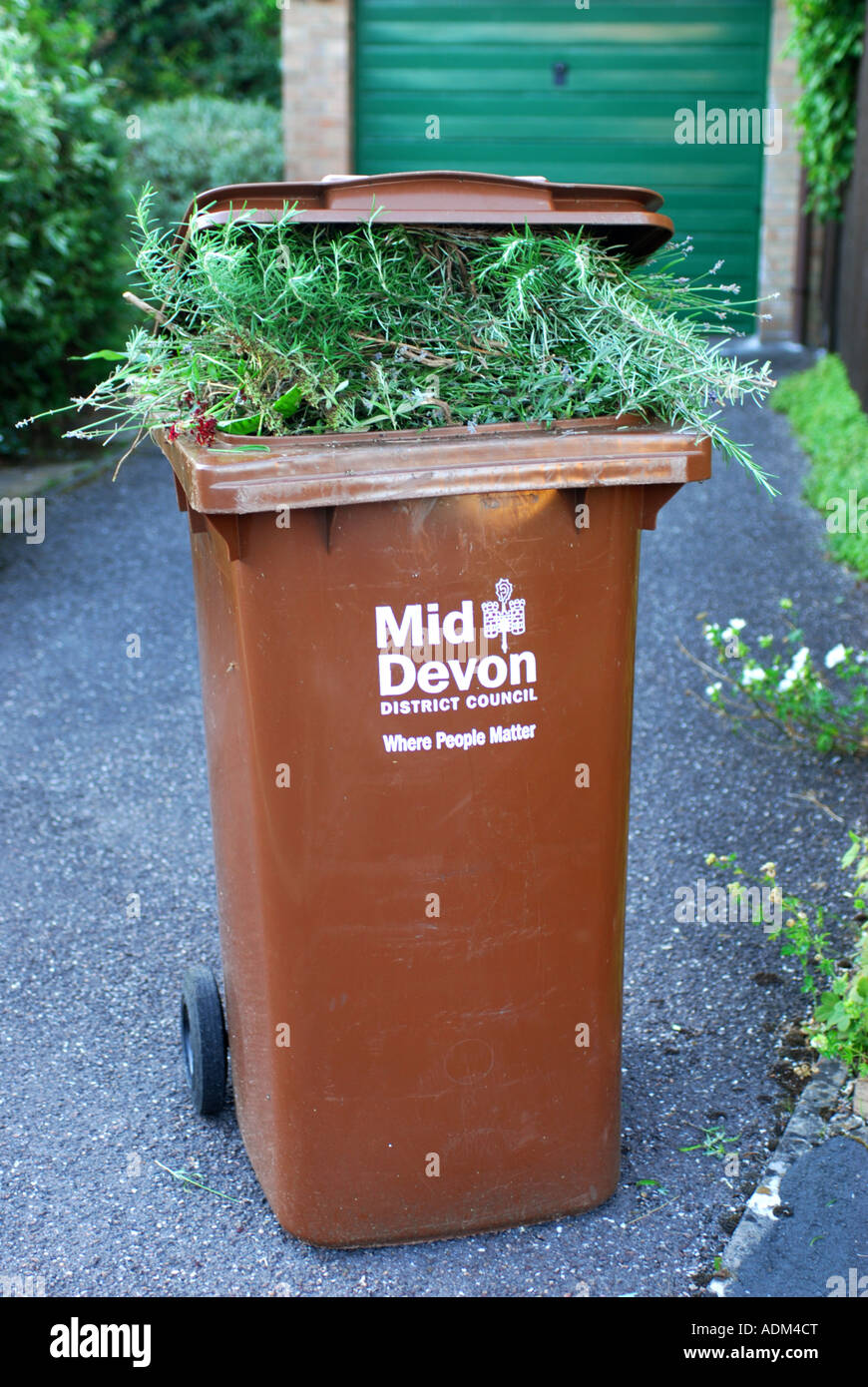 Wheely bins line the streets of Tiverton Devon awaiting early morning ...