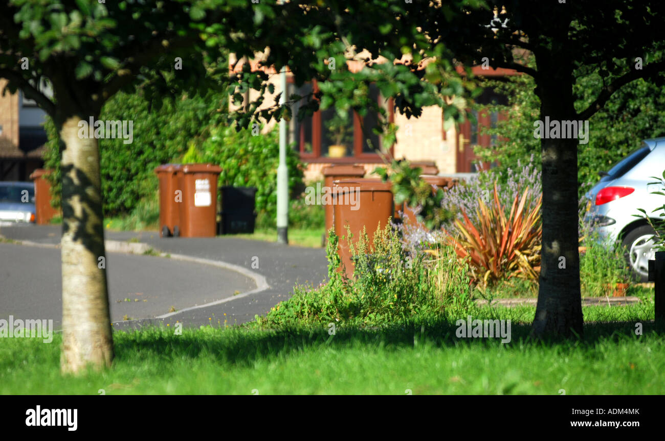 A line of wheely bins awaiting collection in Tiverton Devon Stock Photo ...