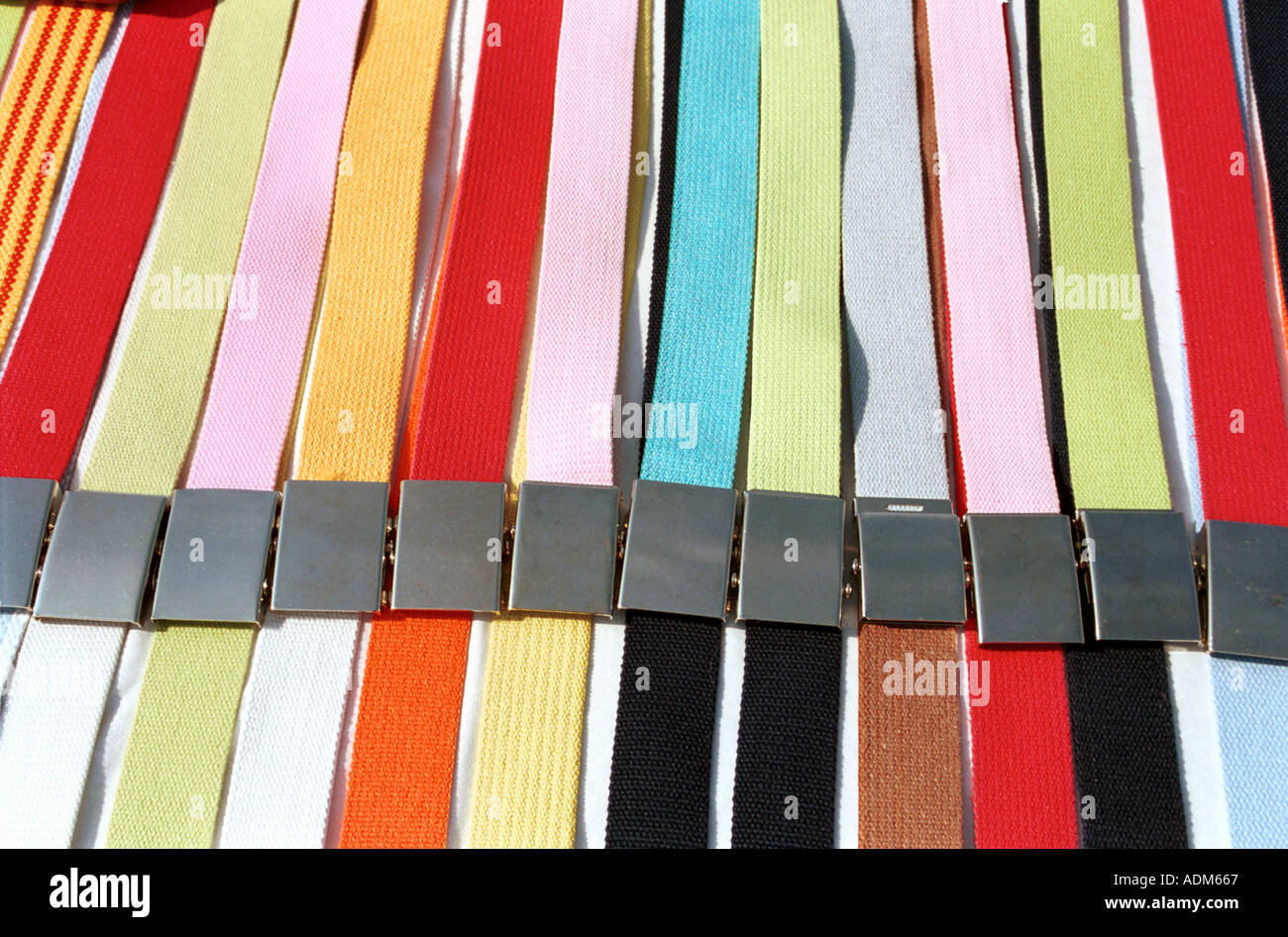 colourful canvas belts on display Stock Photo - Alamy