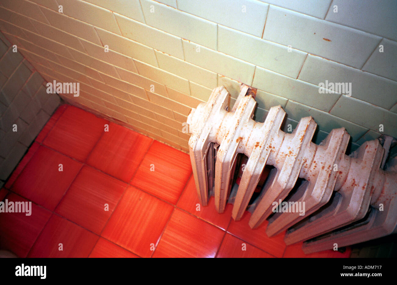 old fashioned radiator and tiled wall and floor Stock Photo - Alamy