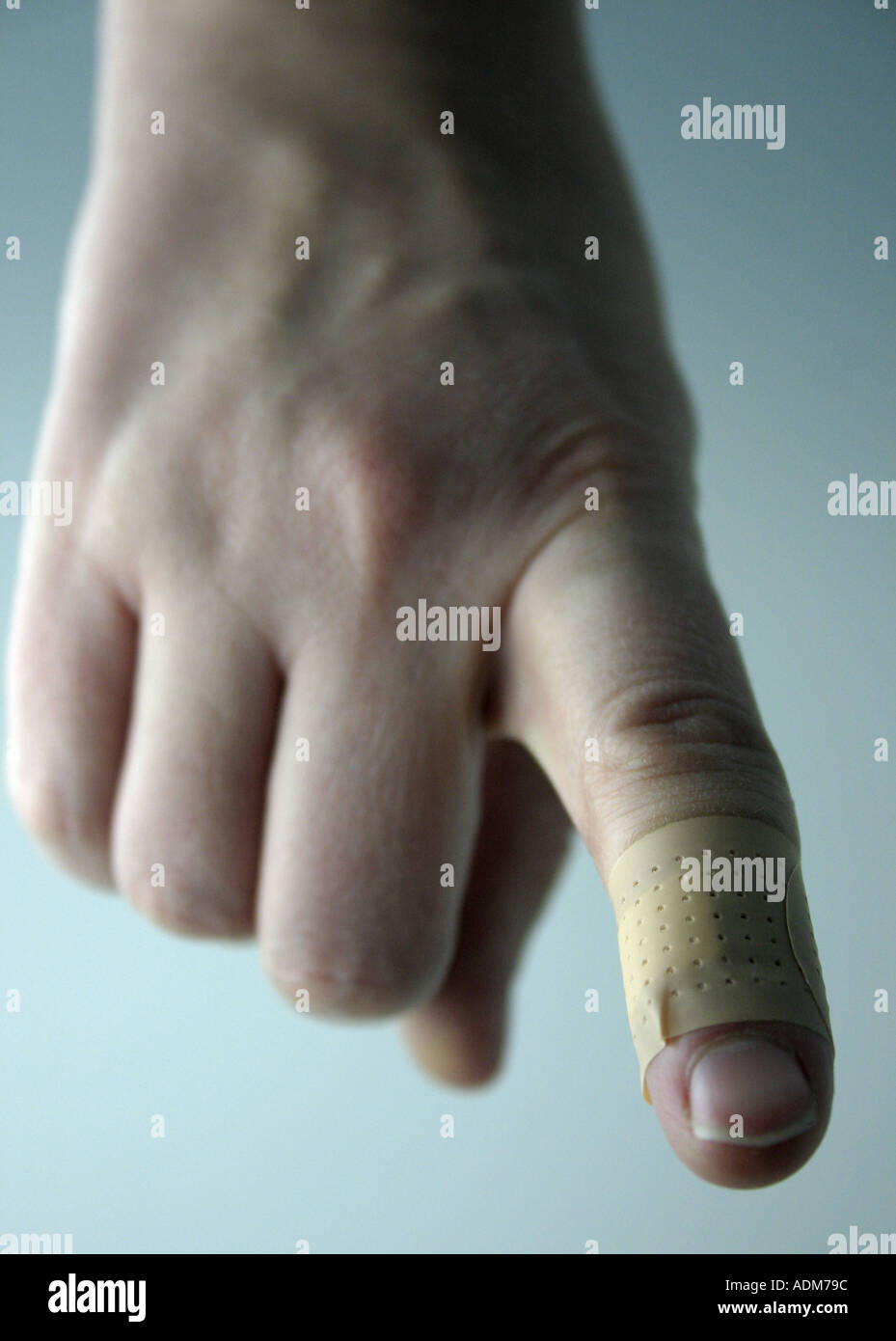 Finger with a plaster on it Stock Photo - Alamy
