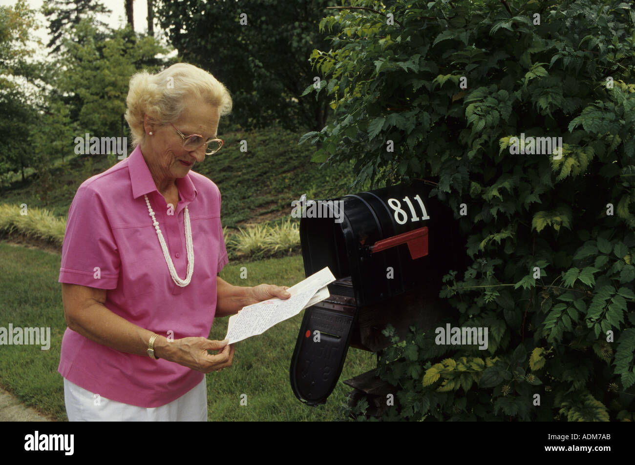 Picking up mail hi-res stock photography and images - Alamy