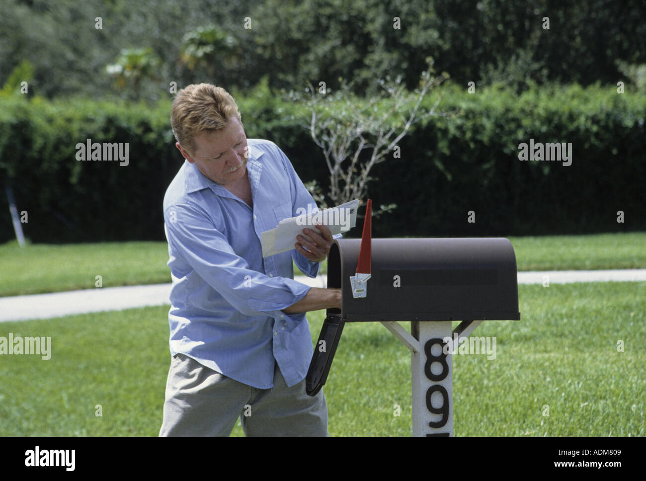 Man Opening Mailbox High Resolution Stock Photography and Images - Alamy
