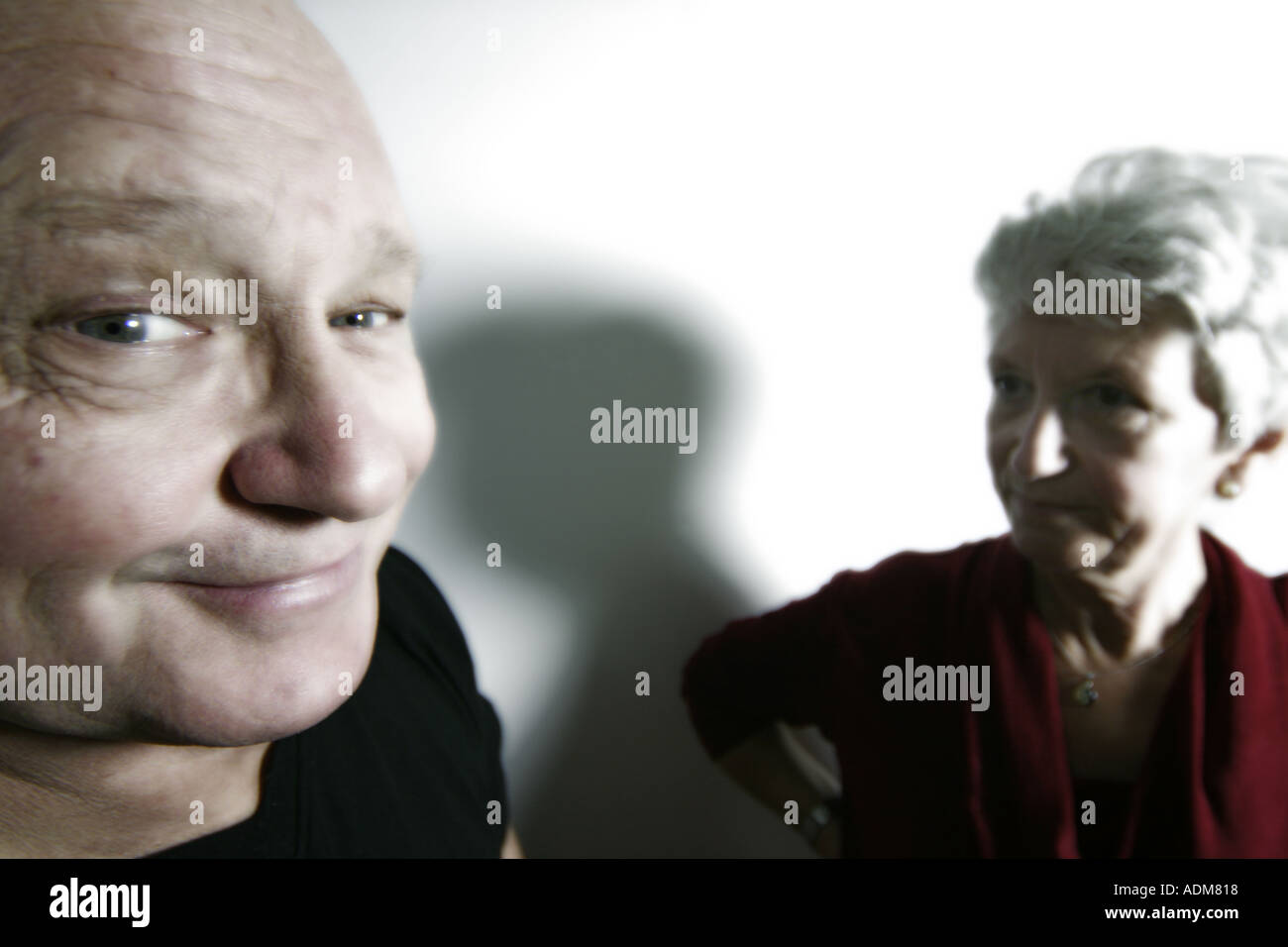 Couple in their sixties Man looks smug woman looks disapprovingly Stock ...