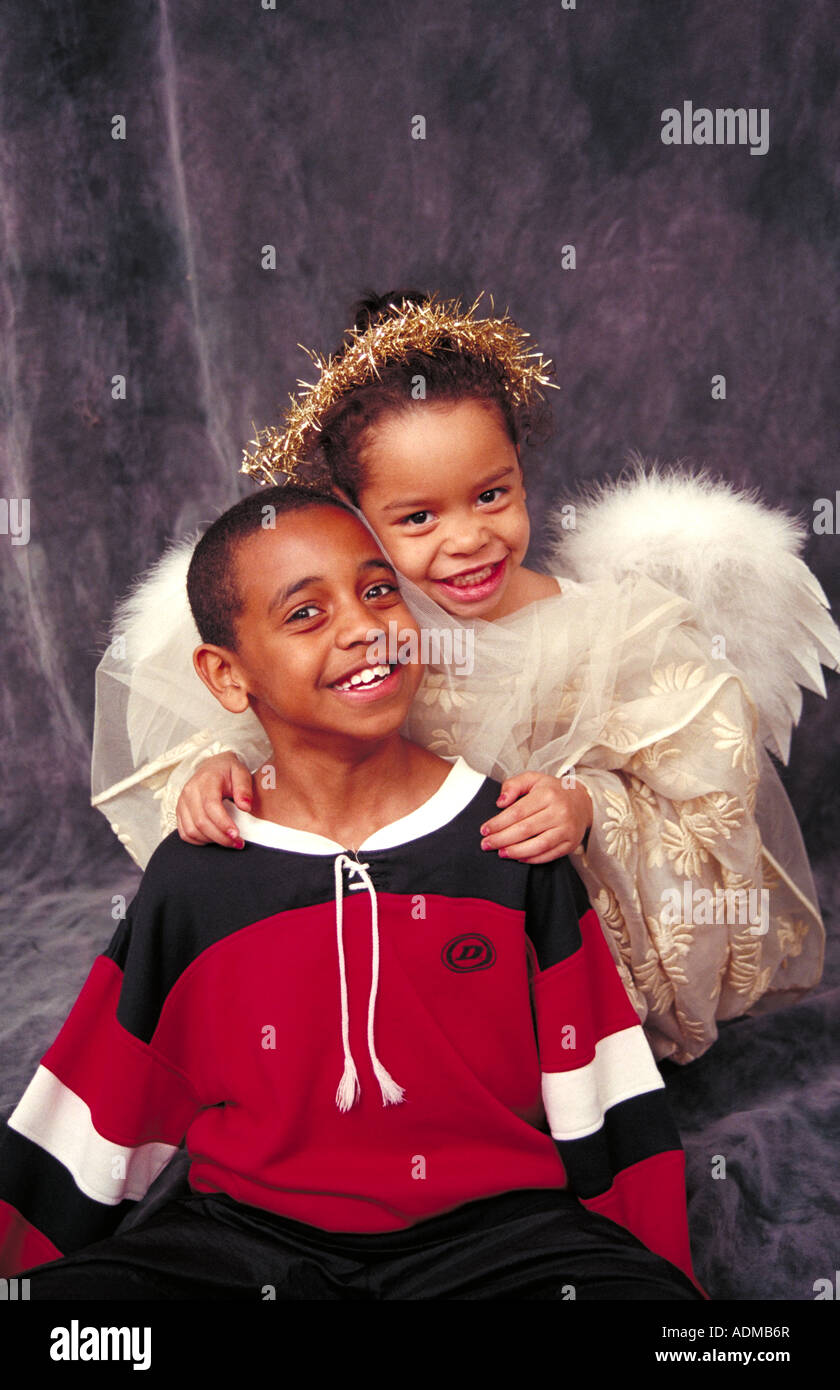 Happy brother and little angel sister. St. Paul, Minnesota Stock Photo ...