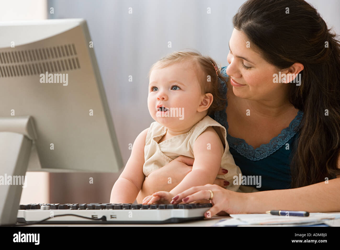 Mother and daughter using computer Stock Photo - Alamy
