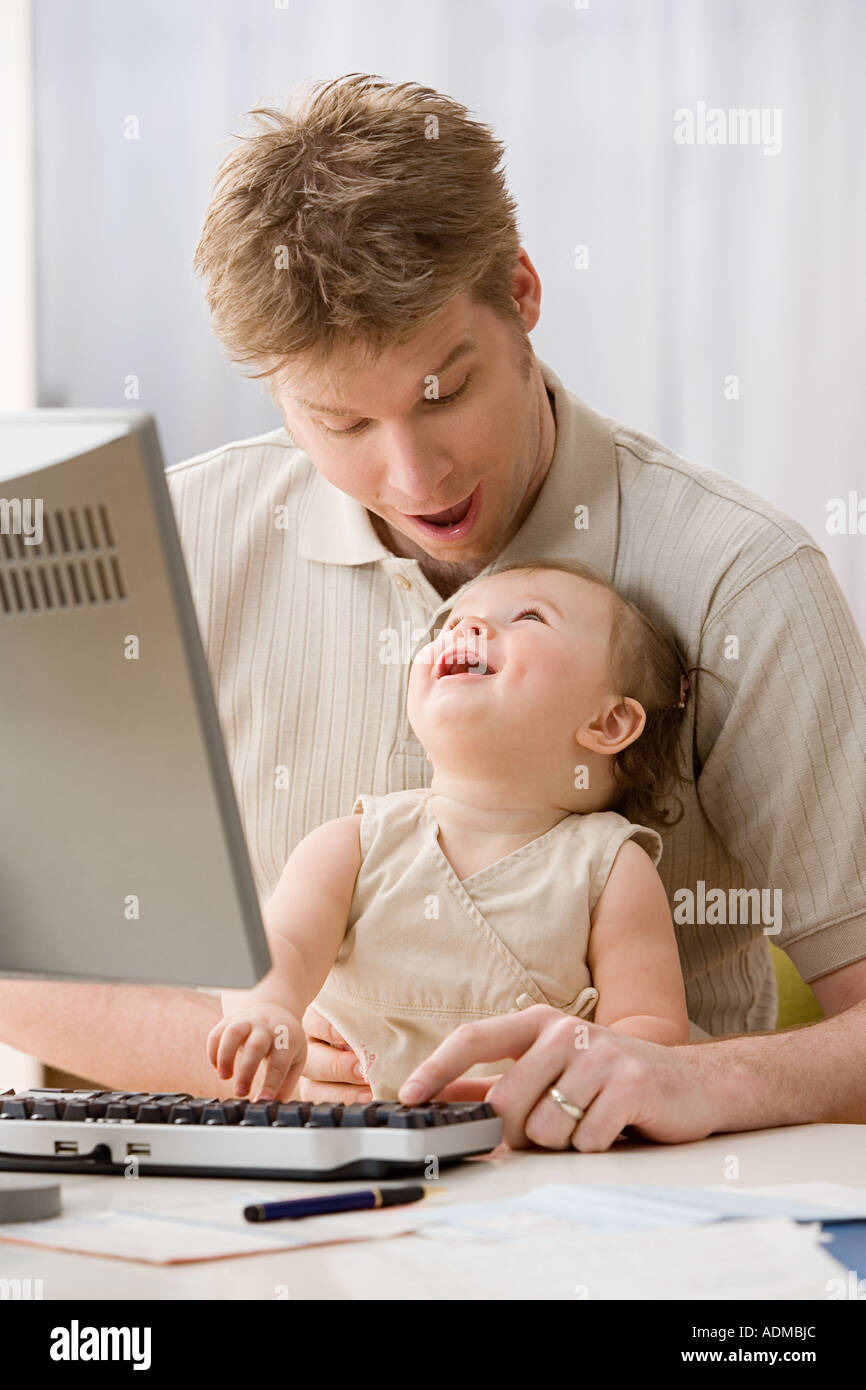Father and daughter using computer Stock Photo - Alamy