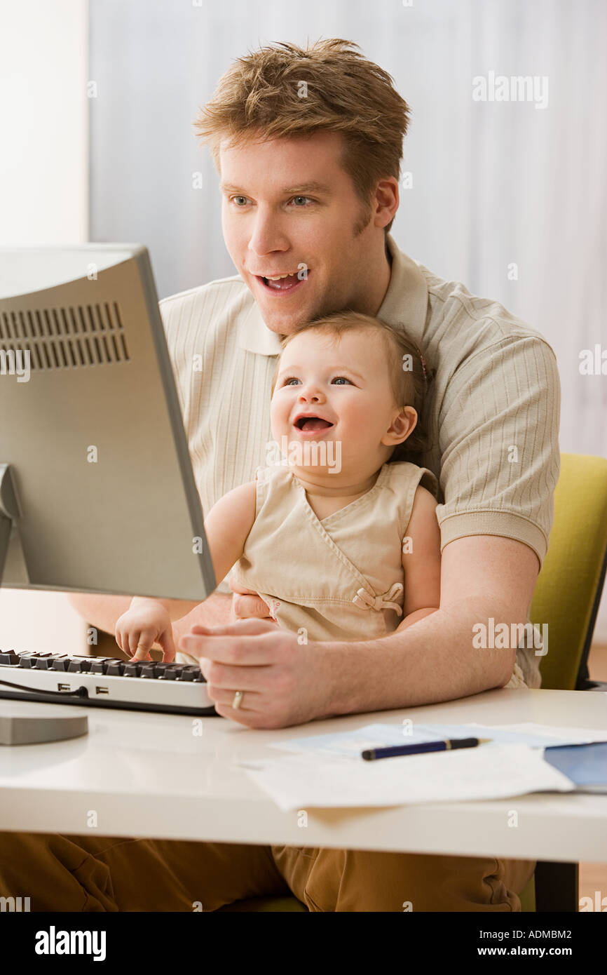 Father and daughter using computer Stock Photo - Alamy
