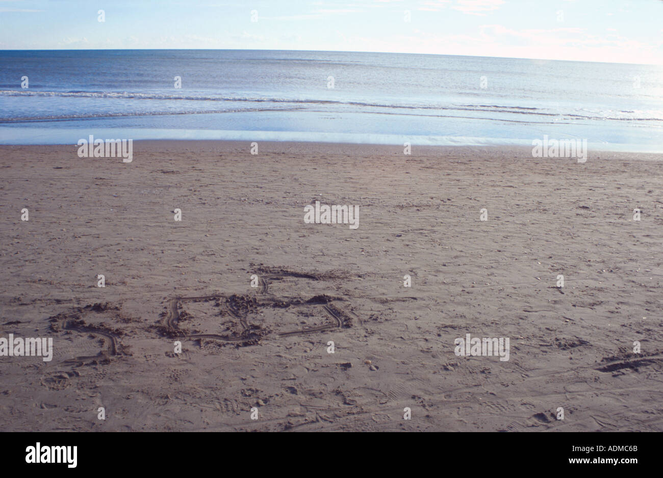 Sos message written on sand hi-res stock photography and images - Alamy