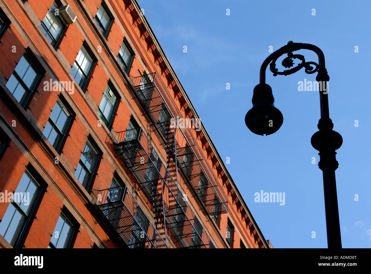 Red Building and Street Lamp Stock Photo - Alamy