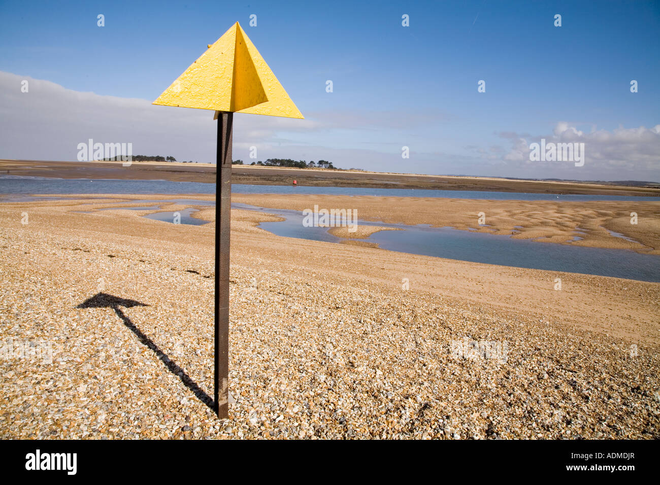 On a beach a yellow warning triangle Stock Photo - Alamy