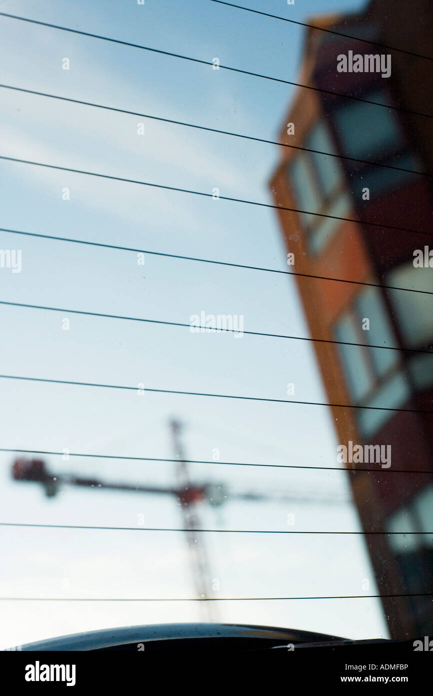 View of building and crane through back windshield of car Stock Photo ...