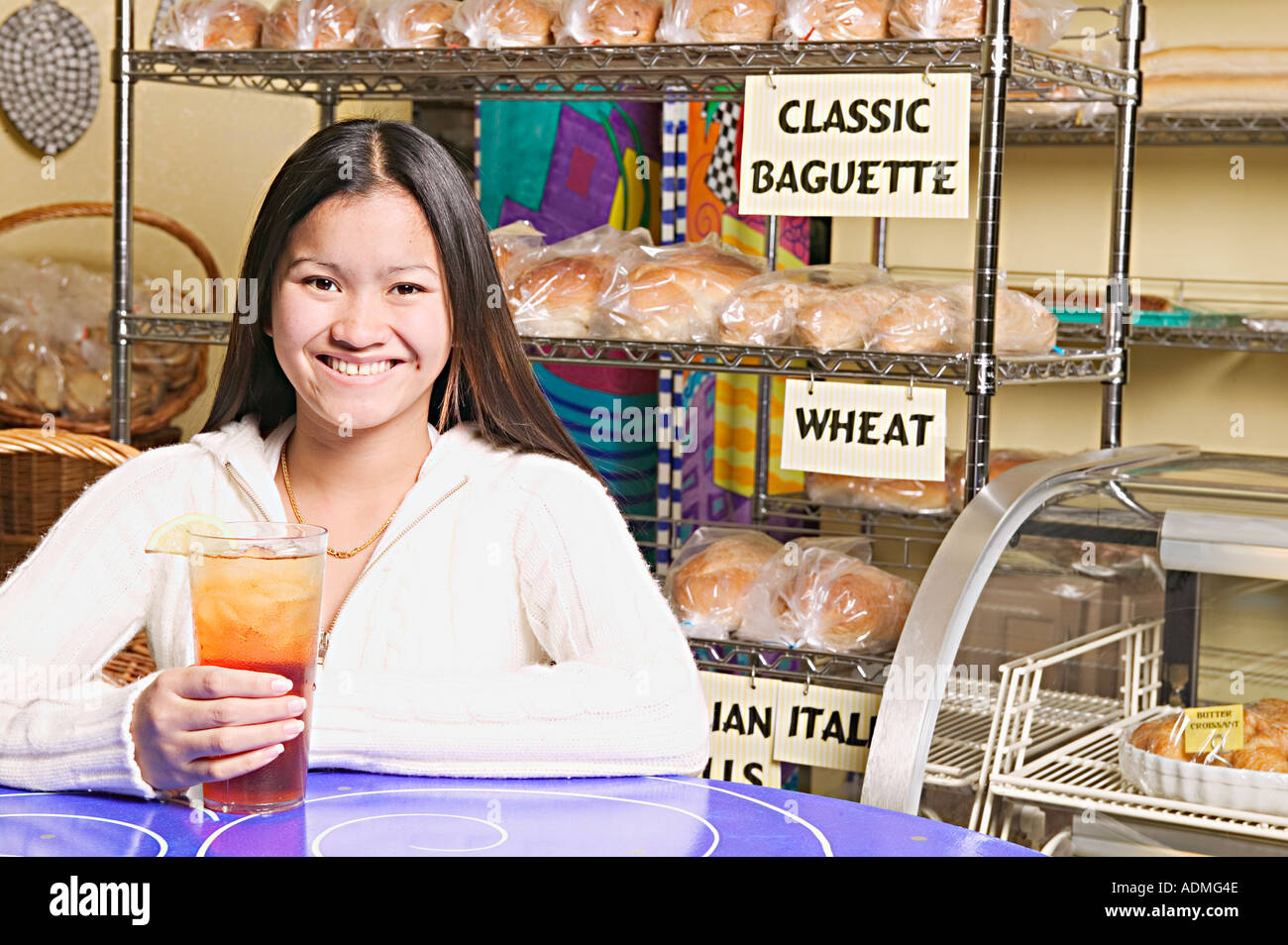Woman in bakery smiling at camera, portrait Stock Photo - Alamy