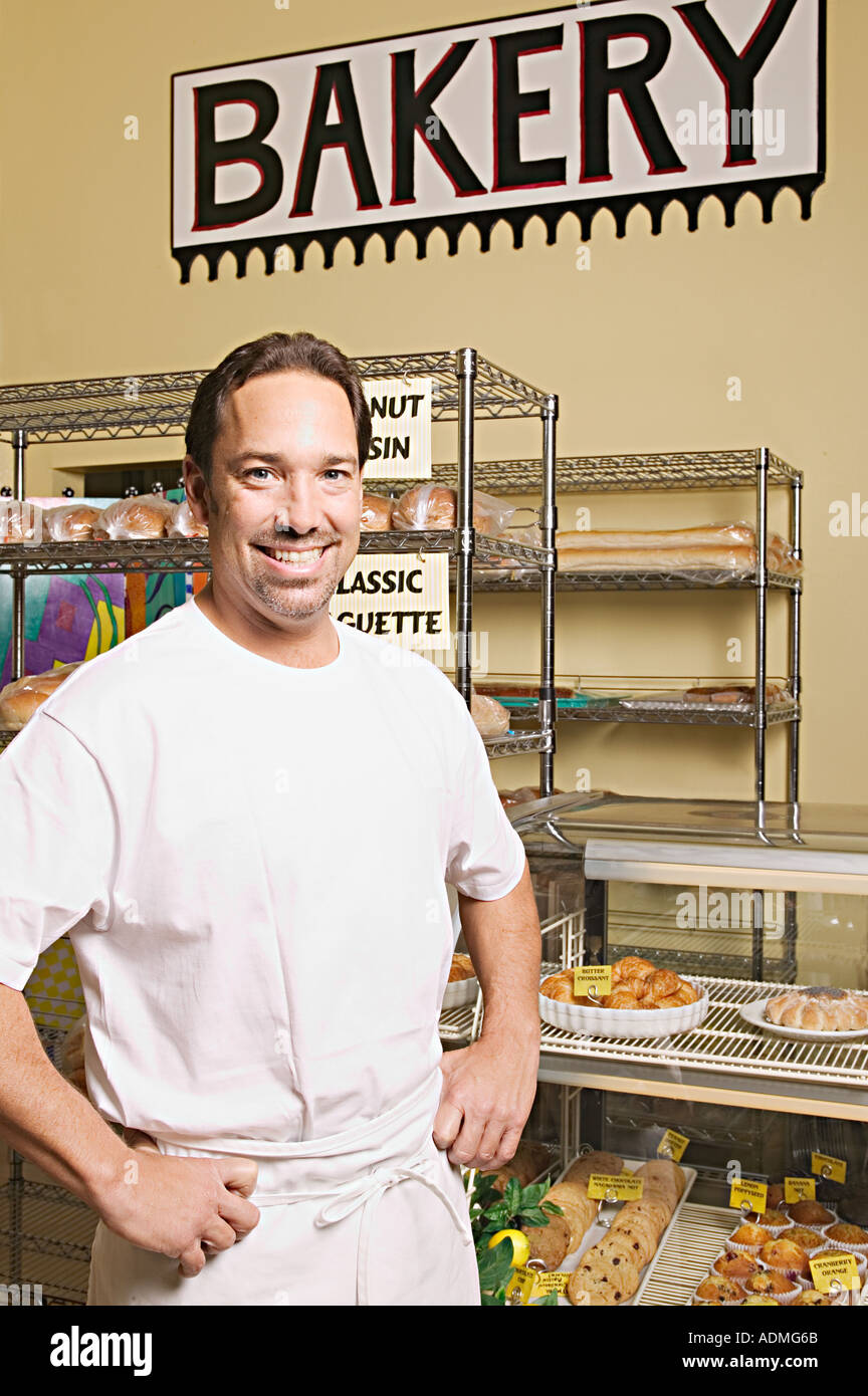 Man in bakery smiling at camera, portrait Stock Photo - Alamy