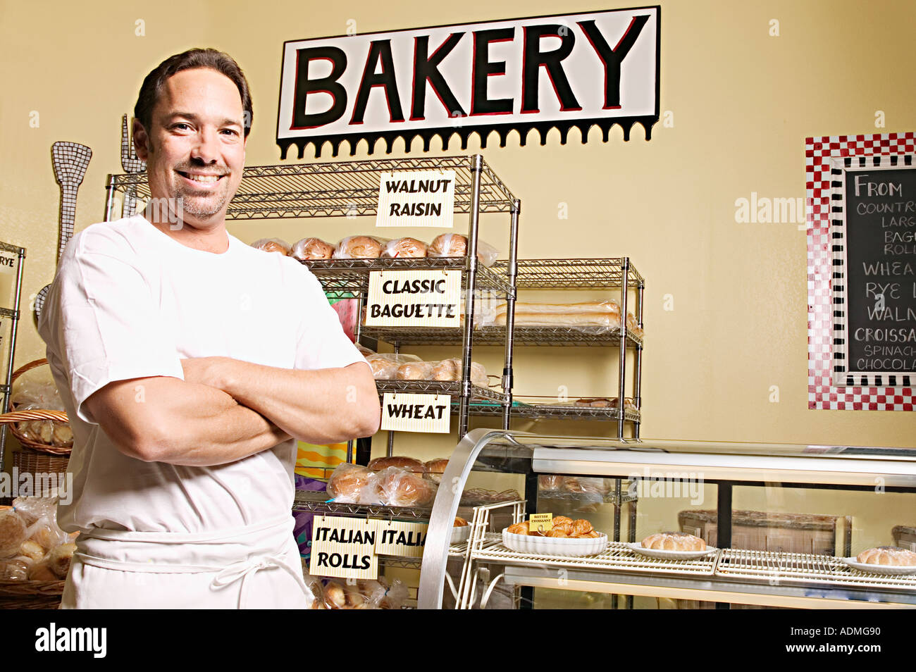 Man in bakery smiling and looing at camera, portrait Stock Photo - Alamy