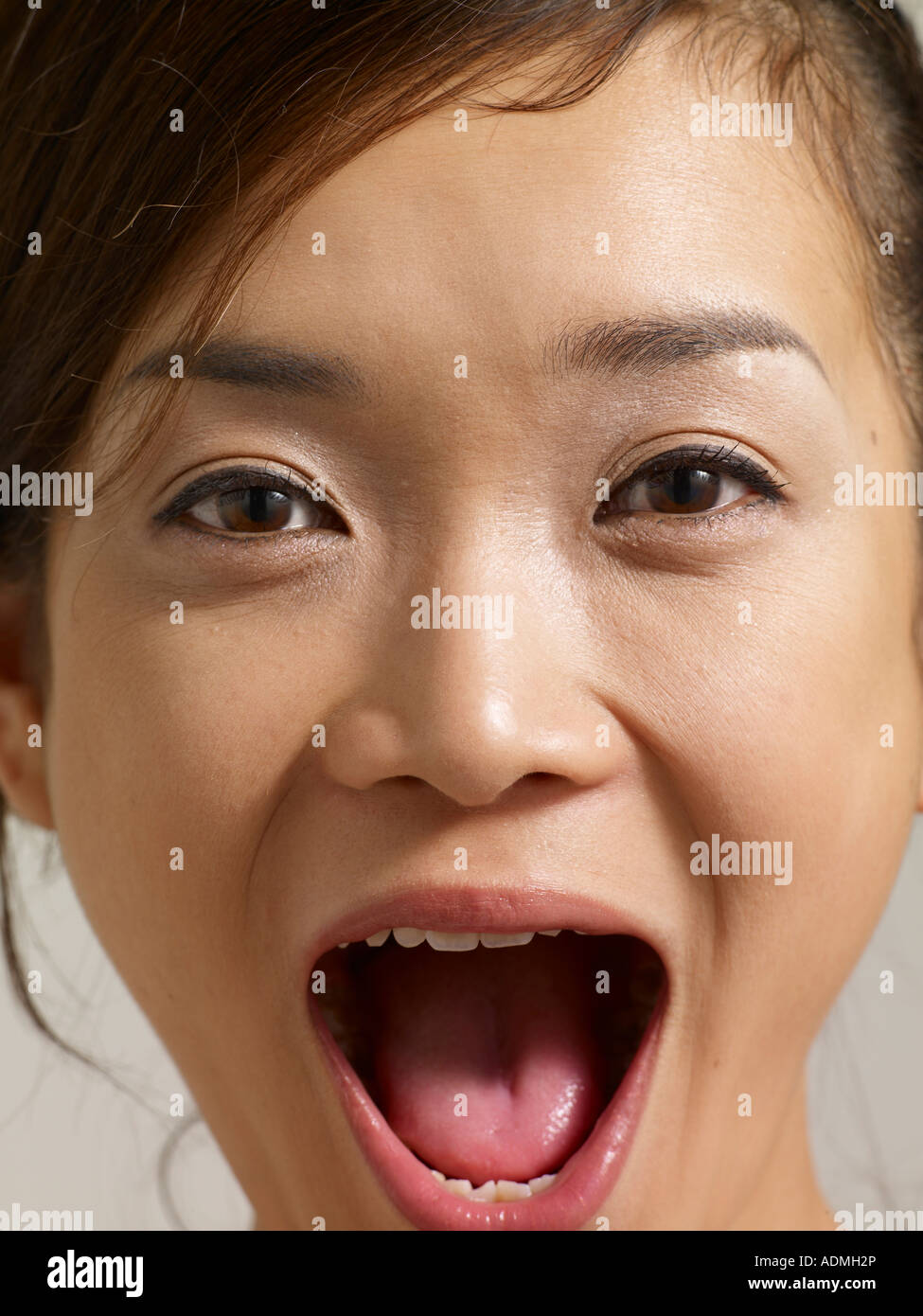 Close up of young woman with mouth open Stock Photo - Alamy