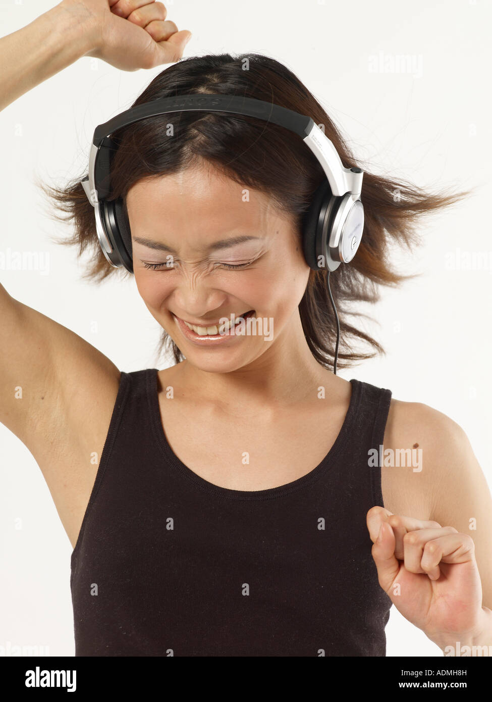 Woman with headphones dancing Stock Photo - Alamy