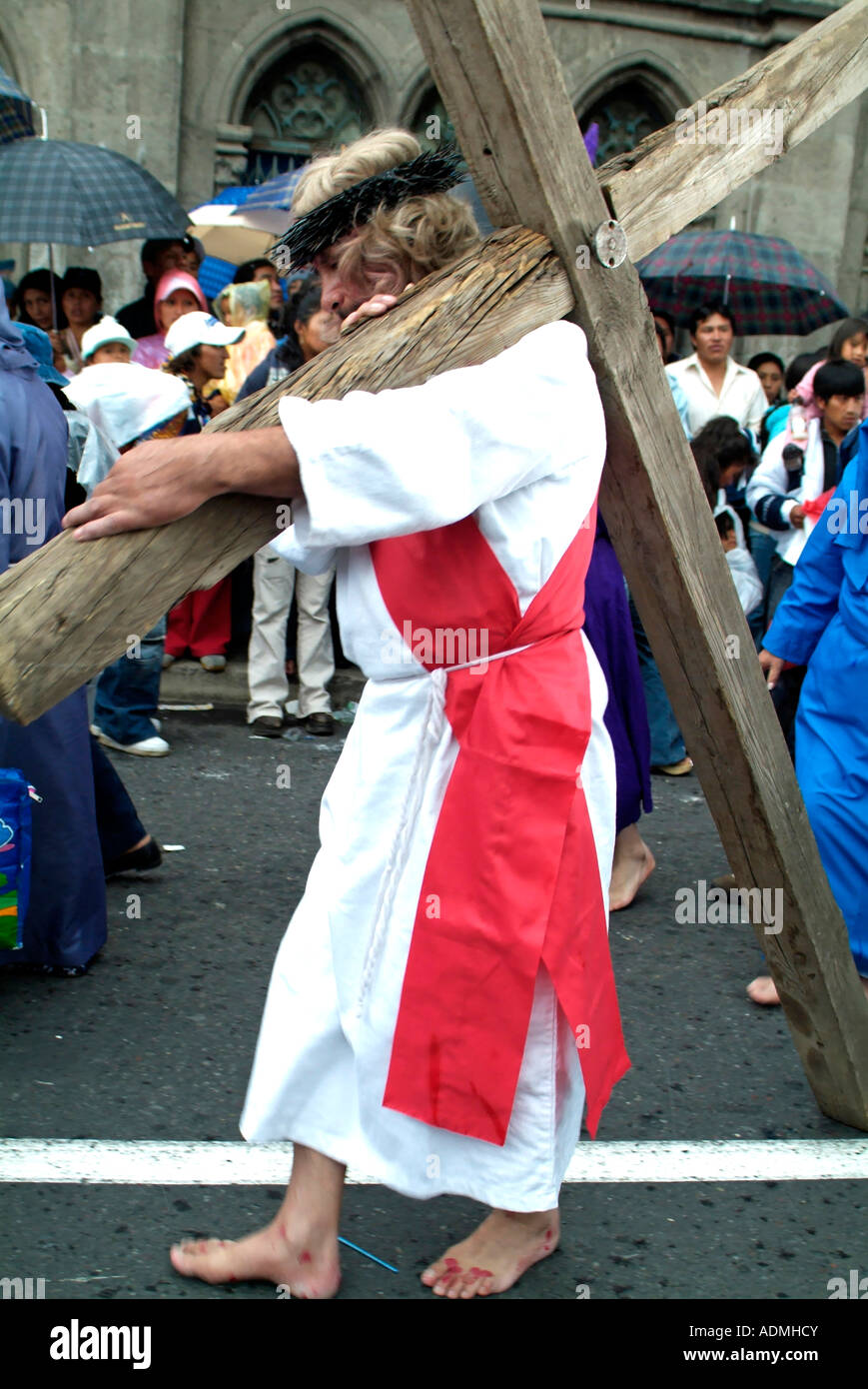 Penitent carrying cross in procession hi-res stock photography and ...