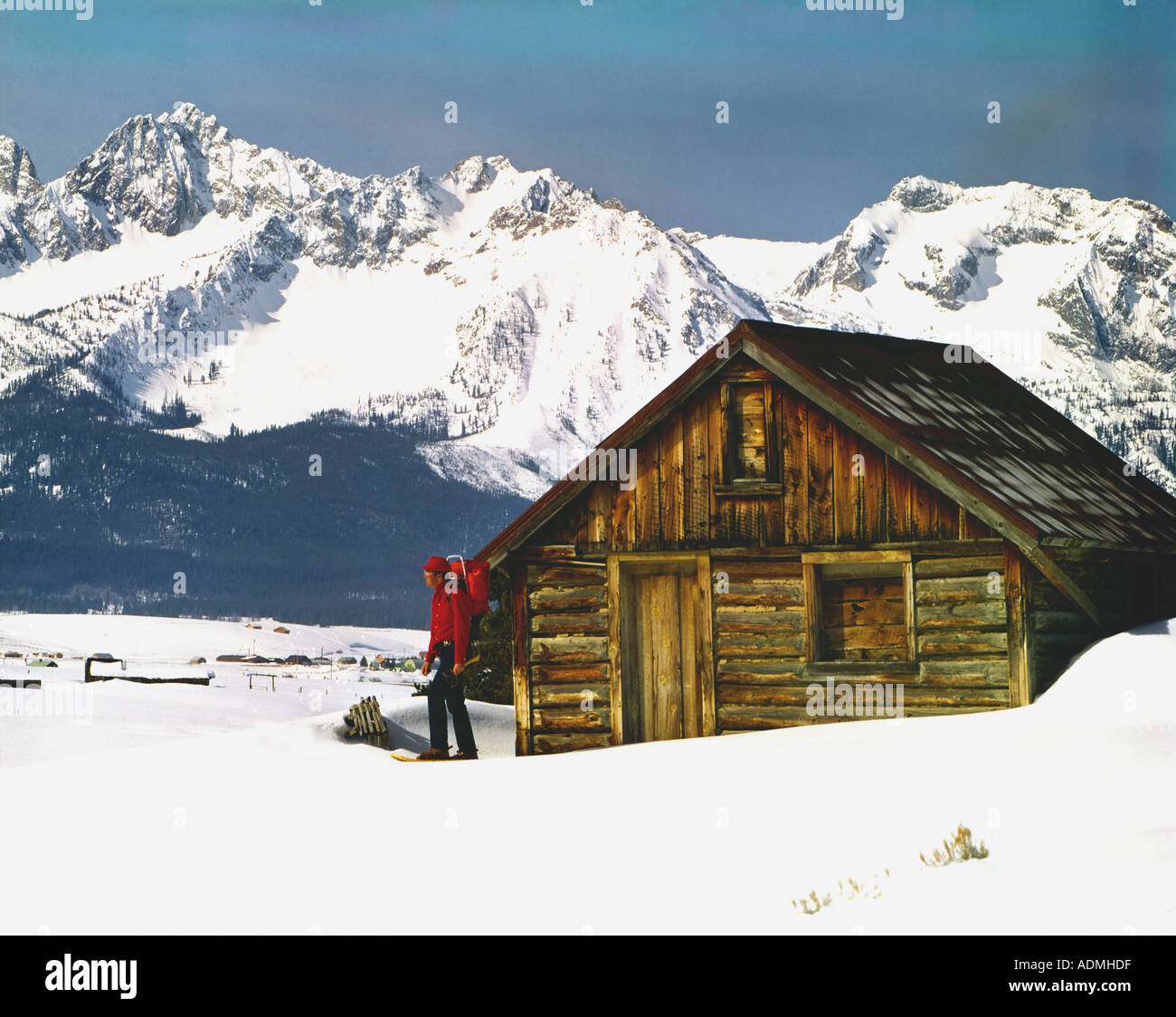 Outdoorsman carrying backpack and hatchet heads for a Winter outing in ...