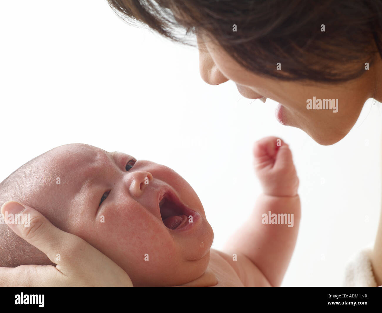 Woman comforting a crying baby Stock Photo - Alamy