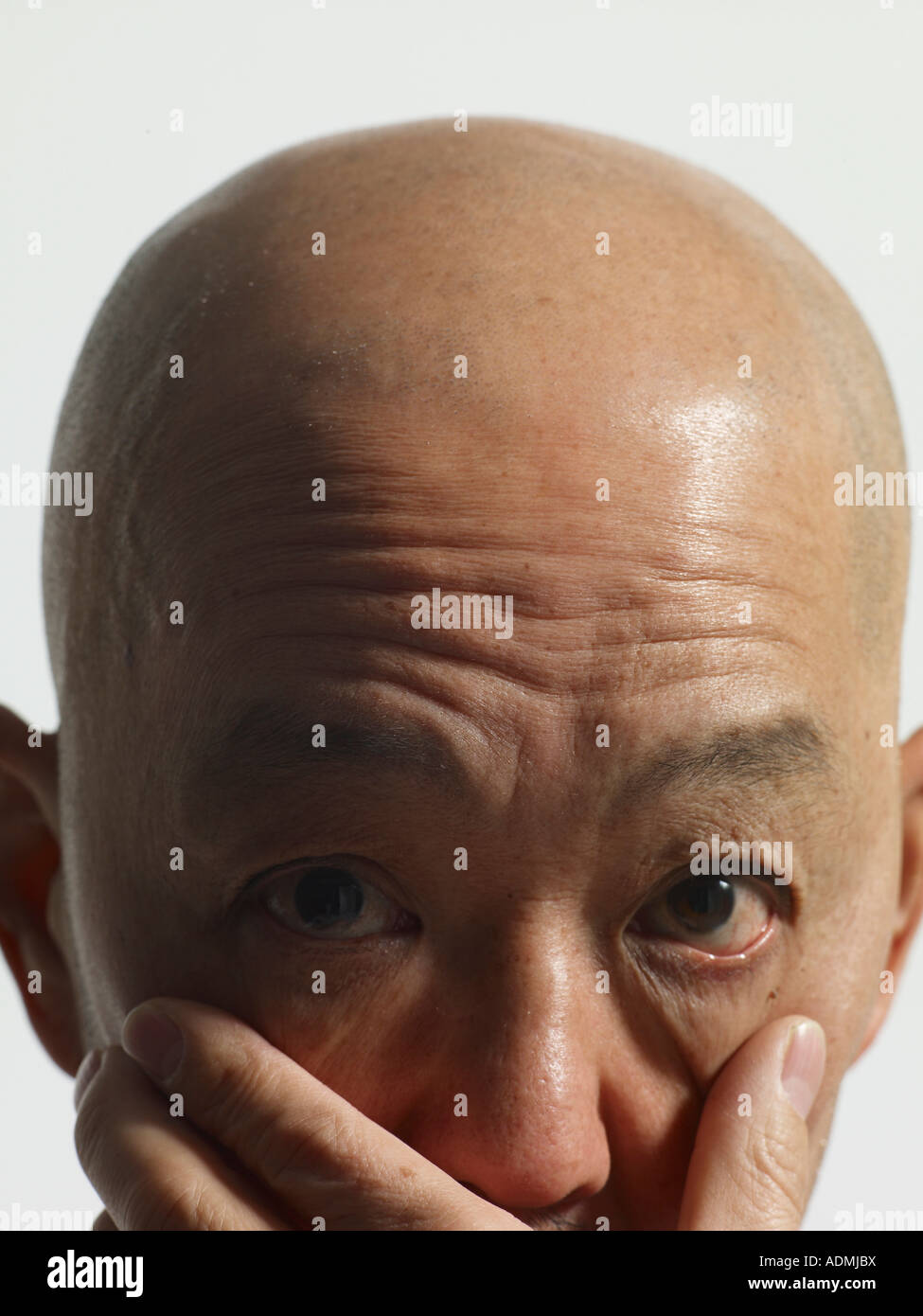 Close up bald man covering face hi-res stock photography and images - Alamy