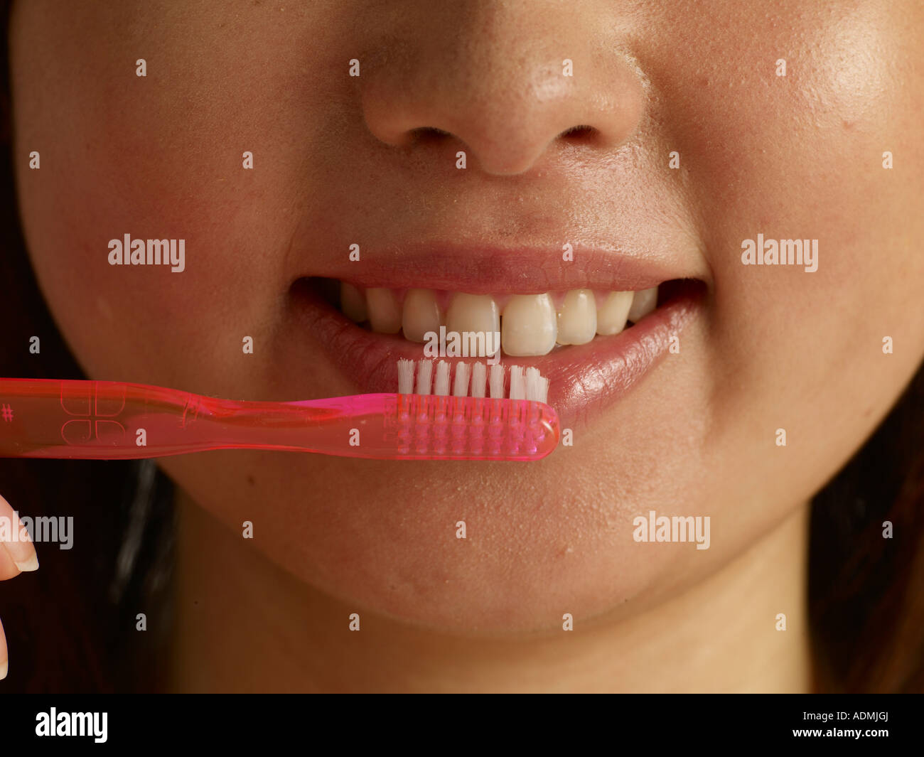 Woman brushing her teeth close up Stock Photo - Alamy