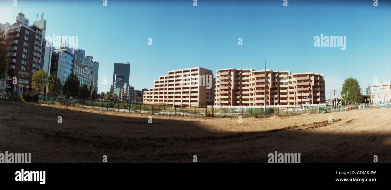Vast open ground with buildings Stock Photo - Alamy