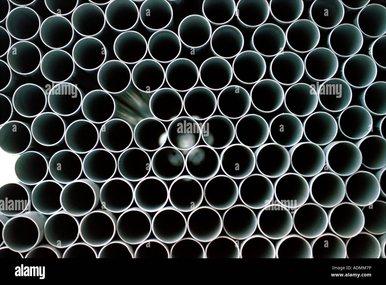 Stacked steel tubing Stock Photo - Alamy